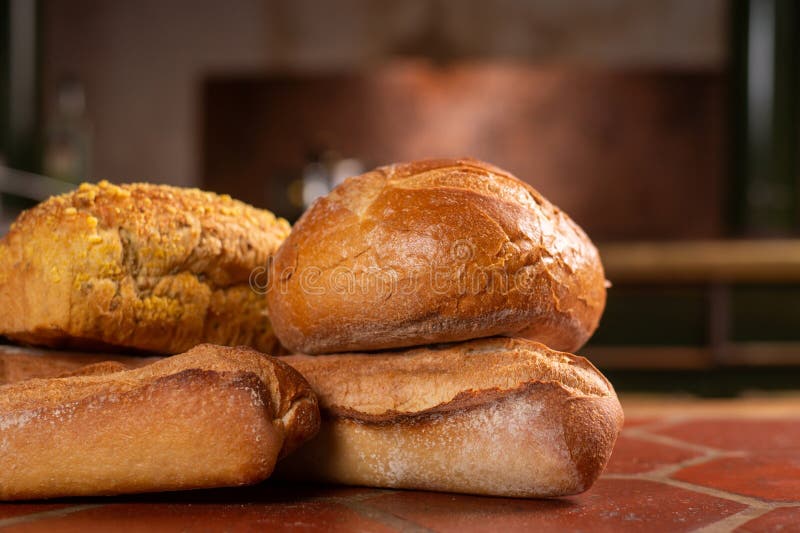 Different Types of French Bread on the Table. Baguettes, Round Bread ...