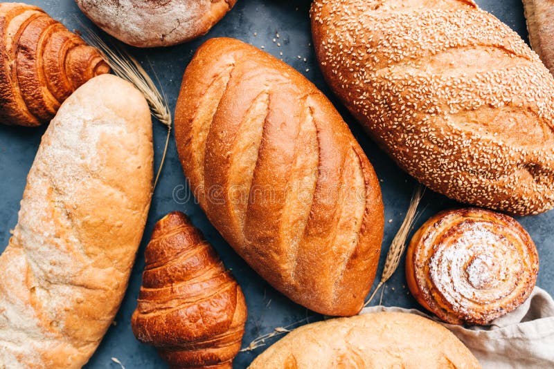 Different Types of Fresh Bread and Bakery on the Table Stock Photo ...