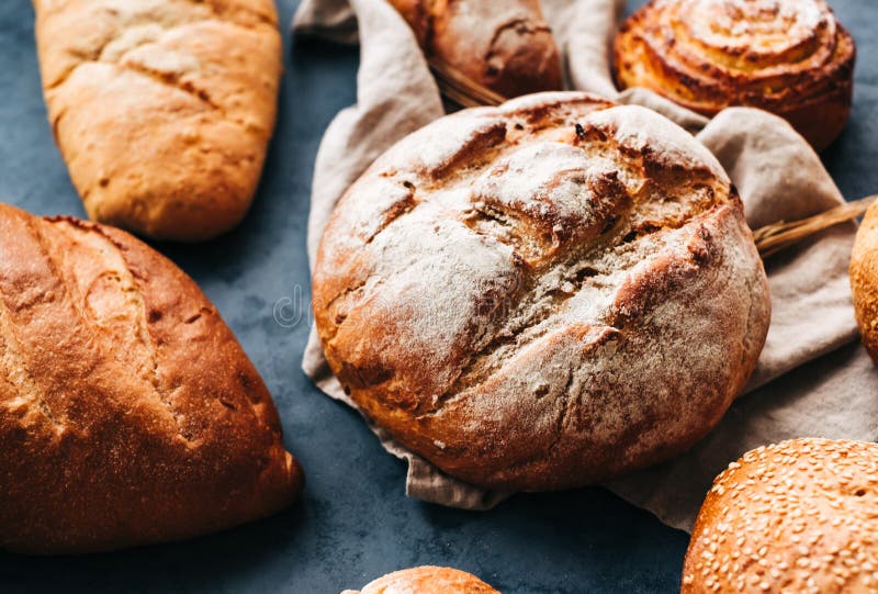Different Types of Fresh Bread and Bakery on the Table Stock Photo ...