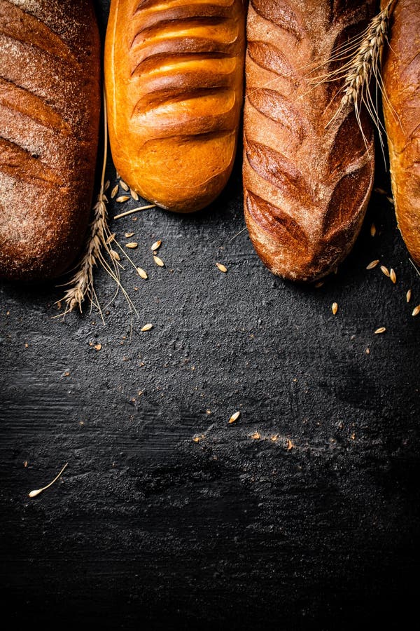 Different Types of Fresh Bread on the Table. Stock Photo - Image of ...
