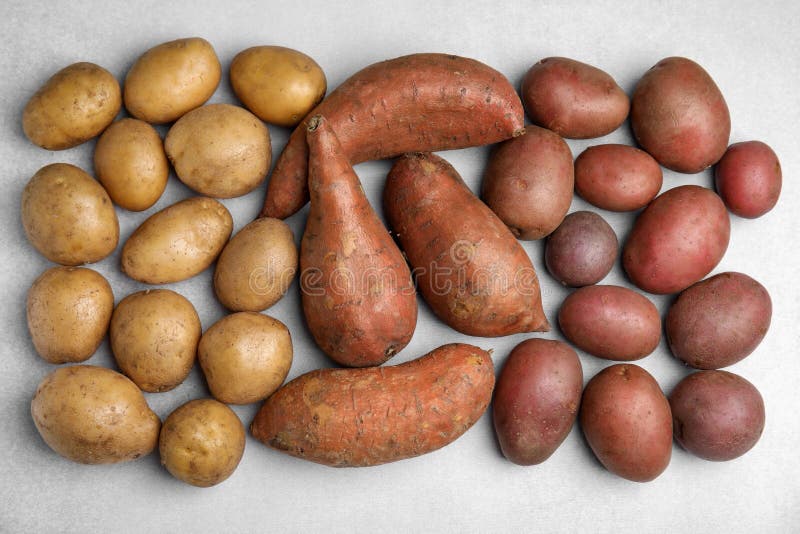 Different Types of Fresh Potatoes on Light Gray Table, Flat Lay Stock ...