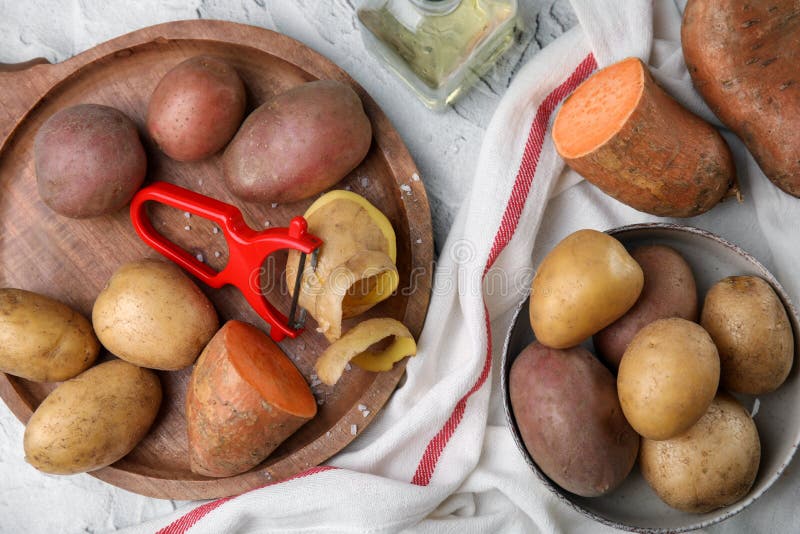 Different Types of Fresh Potatoes on White Textured Table, Flat Lay ...