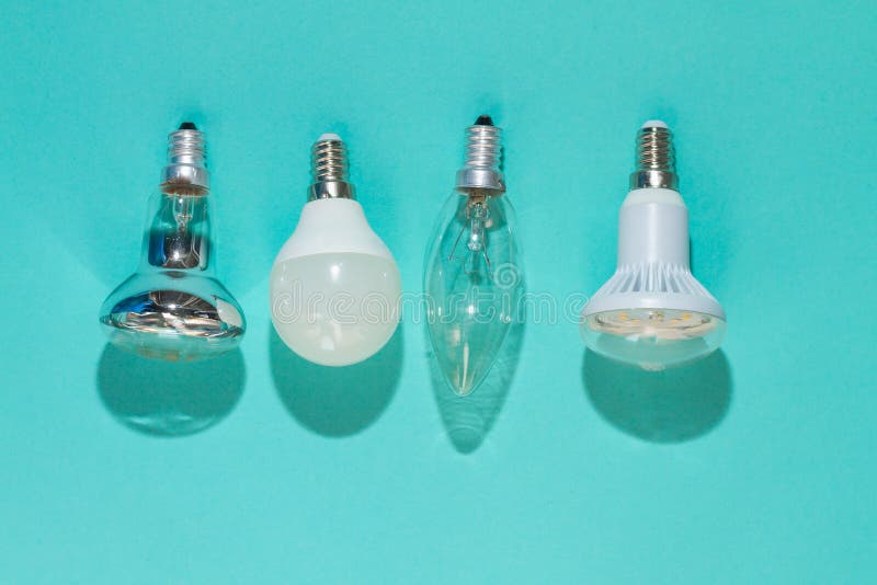 Different Types of Light Bulbs on a Blue Background. Halogen, LED ...