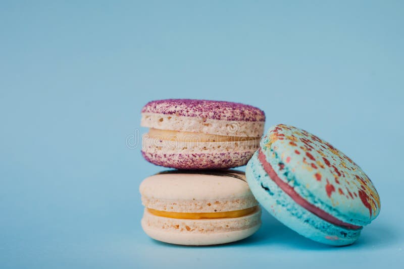 Different Types of Macaroons on a Blue Background Stock Image - Image ...
