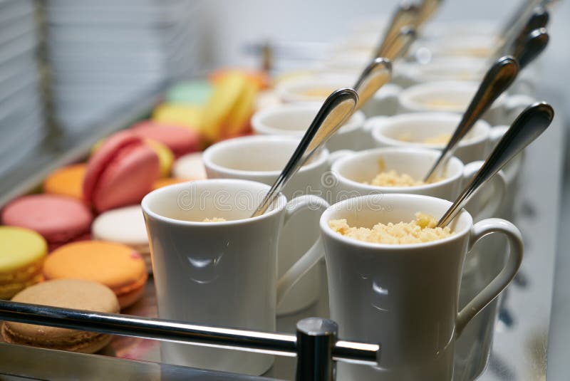 Different Types of Macaroons and Cups of Homemade Yoghurt Stock Photo ...