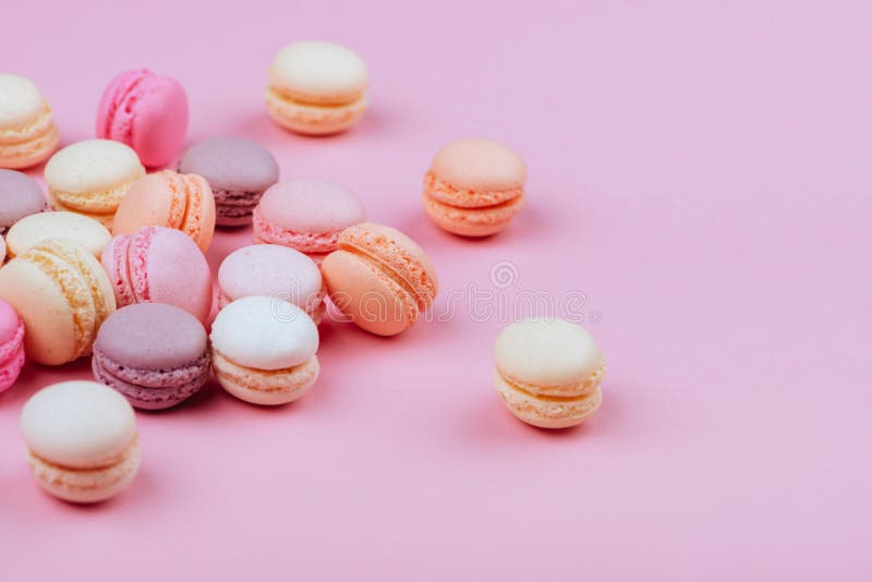 Different Types of Macaroons on Pink Background. Stock Photo - Image of ...