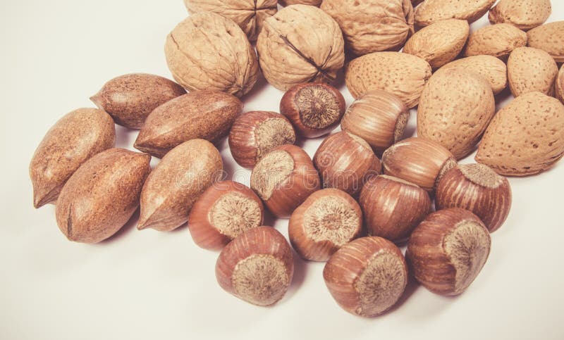 Different Types of Nuts in a Shell on a Wooden Background. Stock Image ...