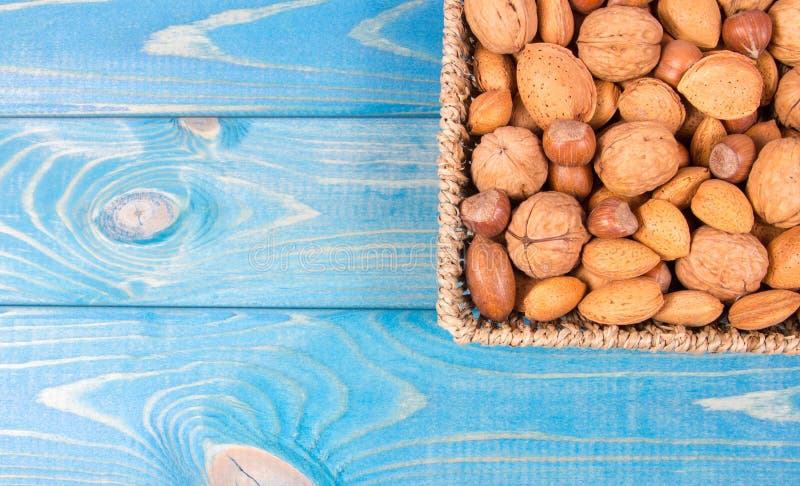 Different Types of Nuts in a Shell on a Wooden Background. Stock Photo ...
