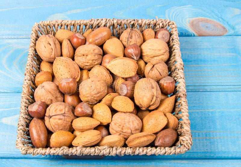 Different Types of Nuts in a Shell on a Wooden Background. Stock Photo ...