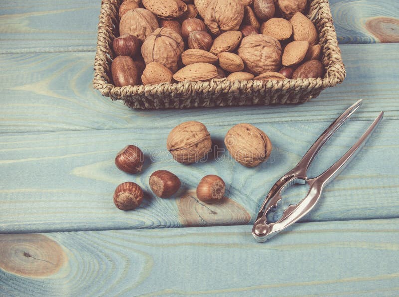 Different Types of Nuts in a Shell on a Wooden Background. Stock Photo ...