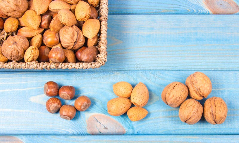Different Types of Nuts in a Shell on a Wooden Background. Stock Photo ...