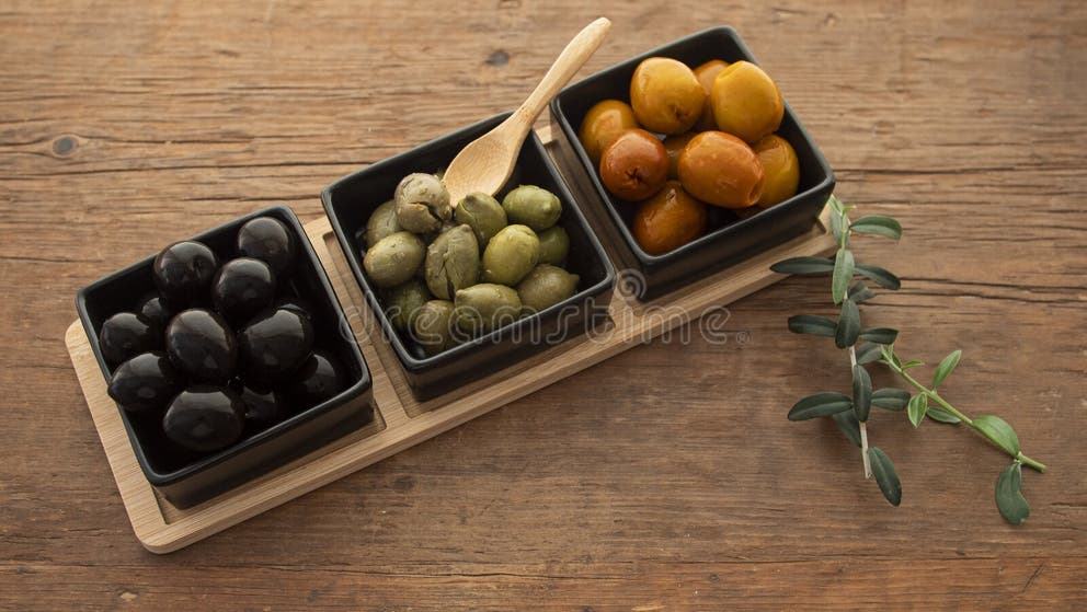 Different Types of Olives in Three Square Black Containers Stock Image ...