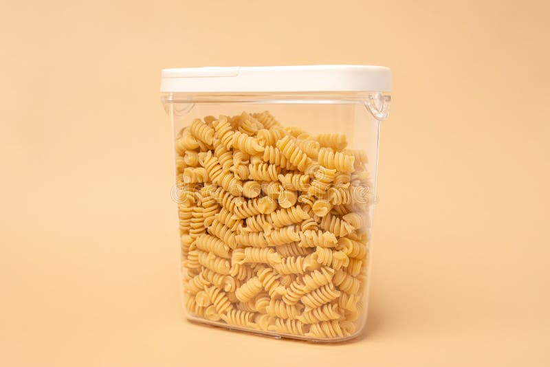 Different Types of Pasta in Containers on a Beige Background Stock ...
