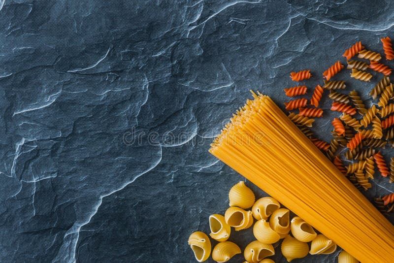 Different Types of Pasta on a Stone Background Stock Photo - Image of ...