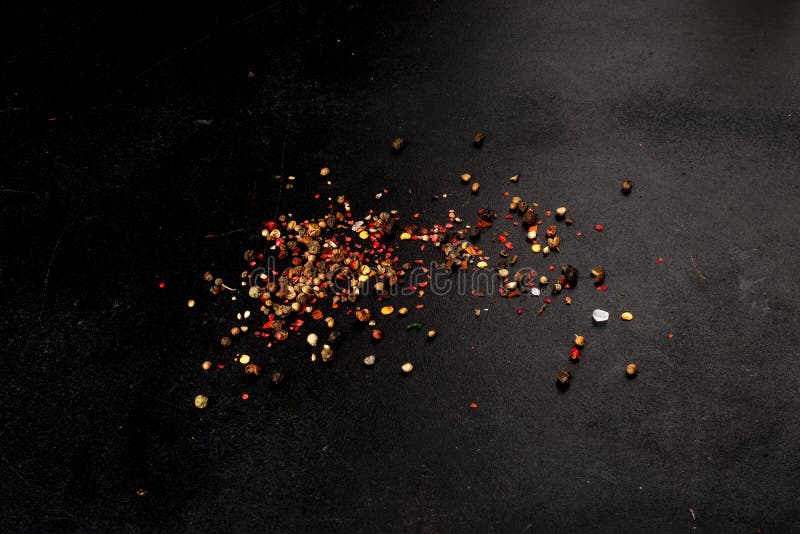 Different Types of Pepper Sprinkled on a Black Background Stock Image ...