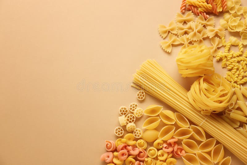 Different Types of Raw Pasta on Color Background Stock Image - Image of ...