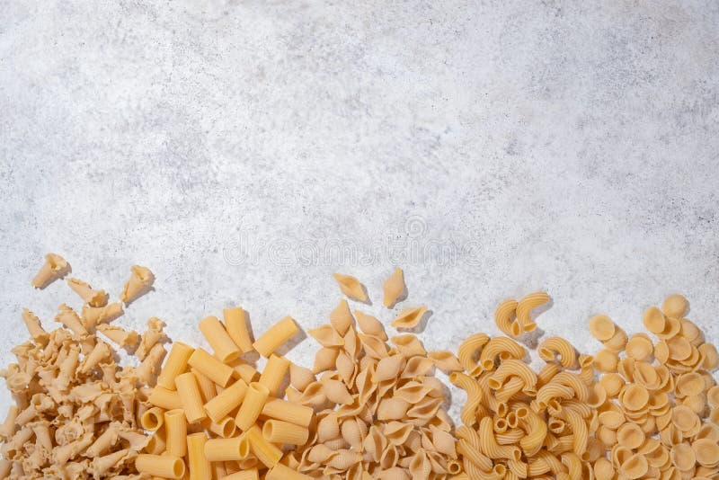 Different Types of Raw Pasta on a Textile Background Stock Image ...