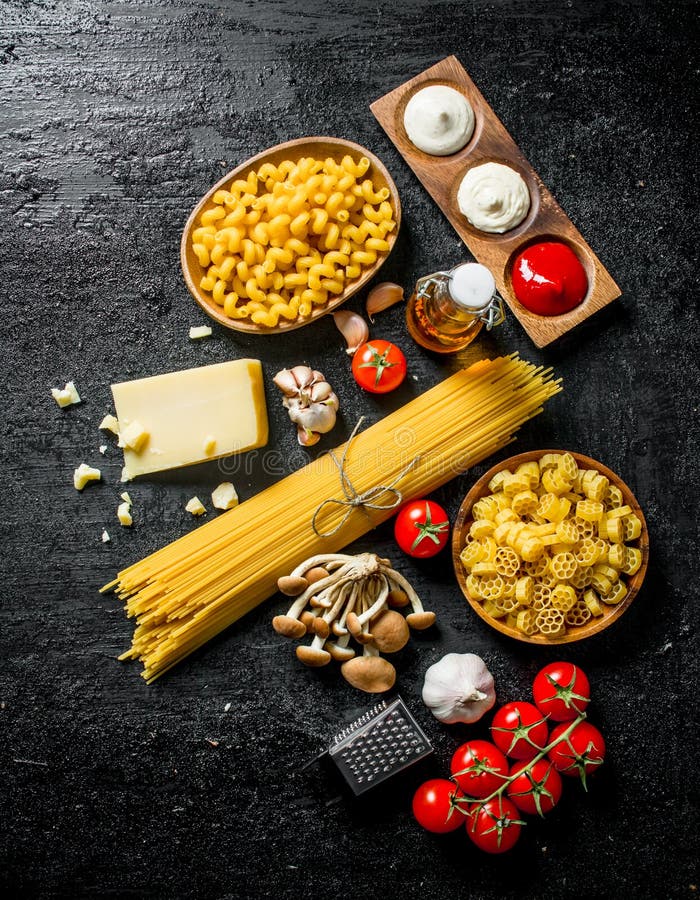Different Types of Raw Paste with Parmesan, Mushrooms and Tomatoes ...