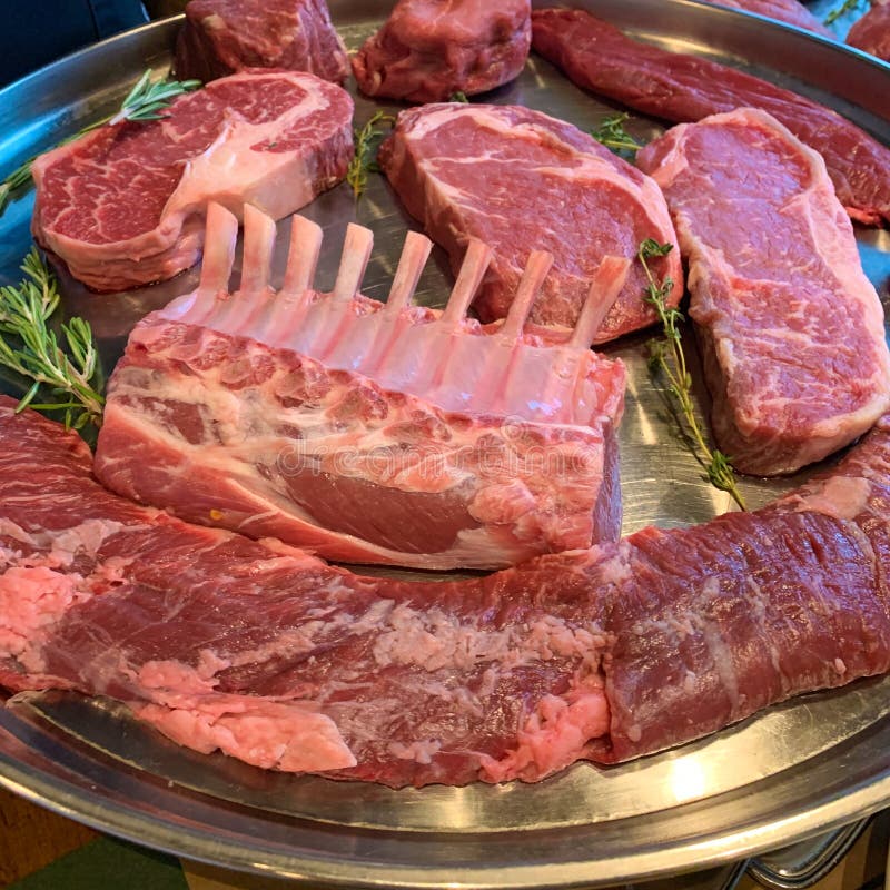 Different Types of Raw Steaks on a Metal Tray. Selective Focus Stock ...