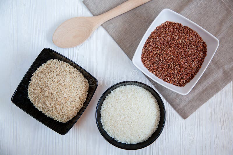 Different Types of Rice in Cups on the Table. White, Brown and Red ...