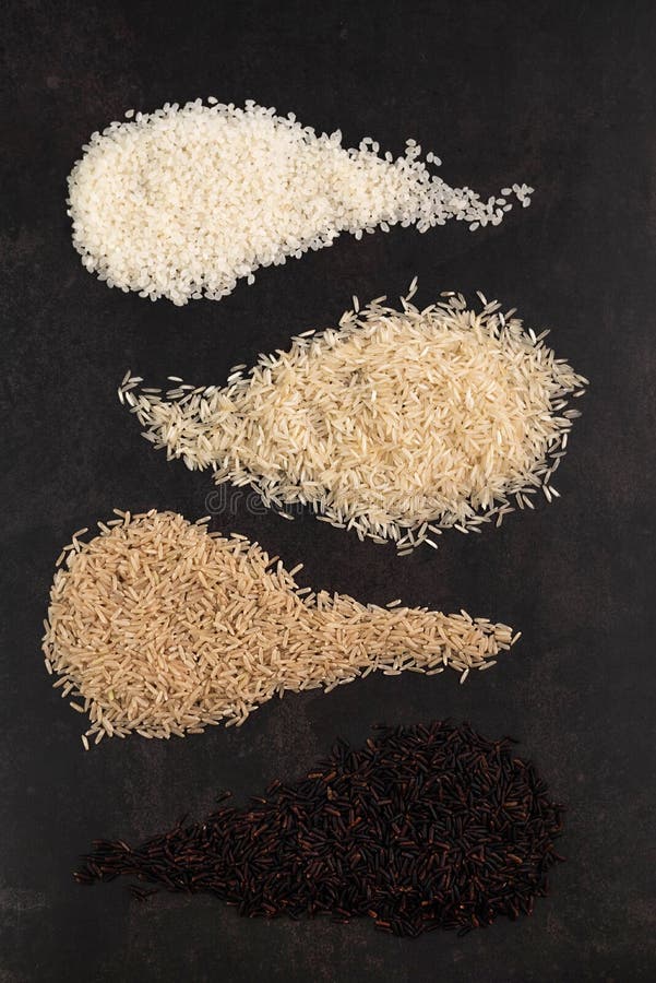 Different Types of Rice are Scattered on a Dark Background. Stock Photo ...