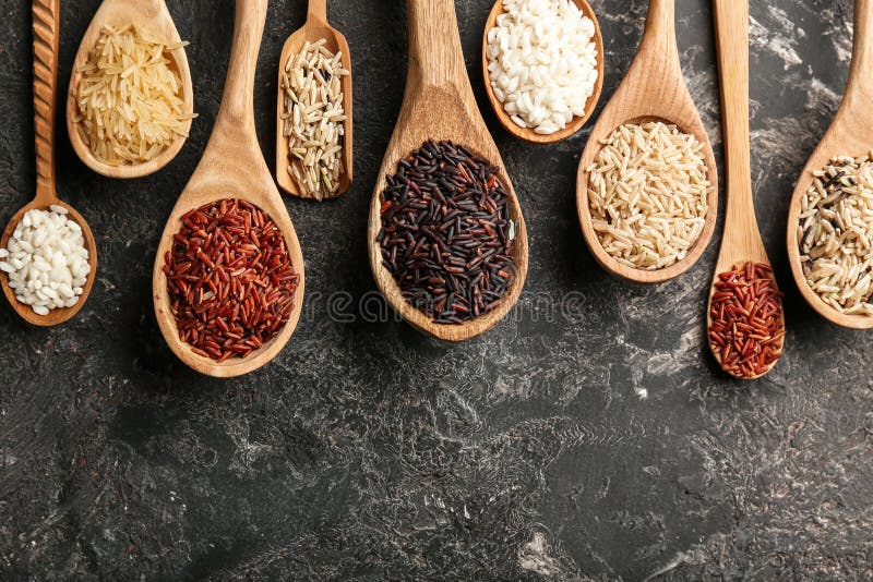 Different Types of Rice in Spoons on Grey Background Stock Photo ... Different Types of Rice in Spoons on Grey Background Stock Photo ...