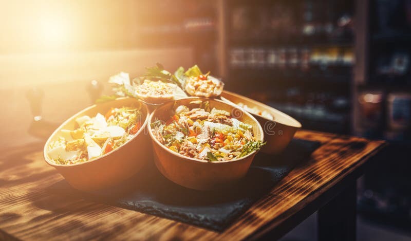 Different Types of Salads in a Bowl on a Wooden Table in a Restaurant ...