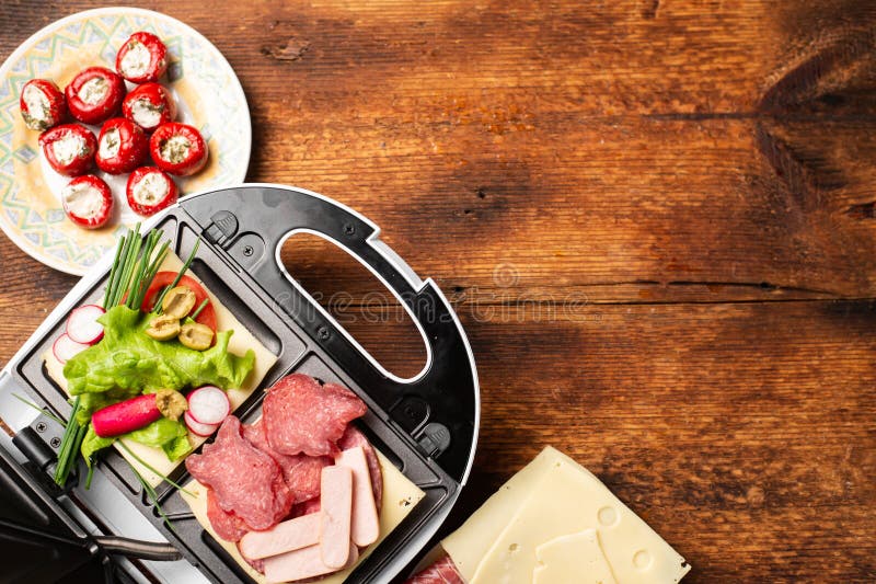 Different Types of Sandwiches in a Sandwich Maker on a Wooden ...