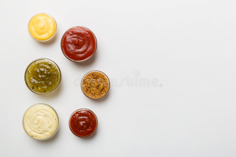 Different Types of Sauces in Bowls on a Colored Board . Top View Stock ...