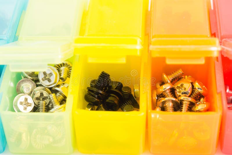 Different Types of Screws in Small Colored Plastic Containers. V Stock ...