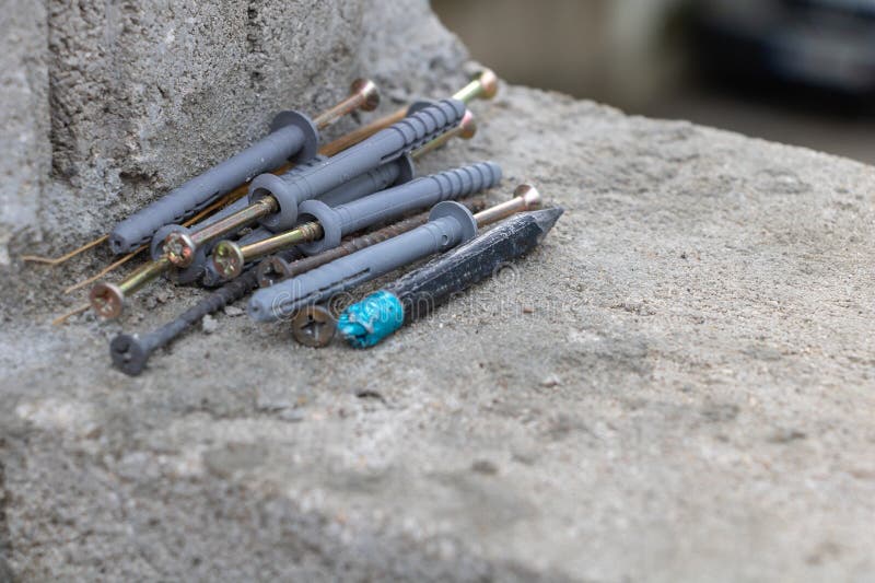Different Types and Sizes of Fasteners on the Concrete Wall Stock Photo ...