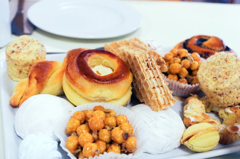 Different Types of Sweet Pastries on Plates Stock Photo - Image of ...