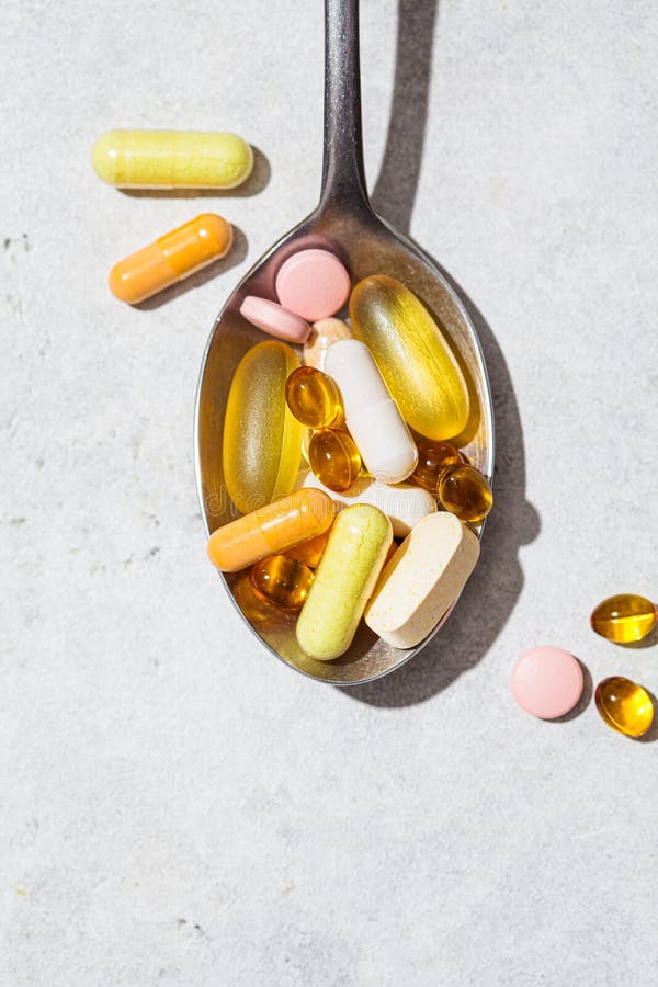 Different Types of Tablets, Pills, Capsules and Vitamins in Spoon ...
