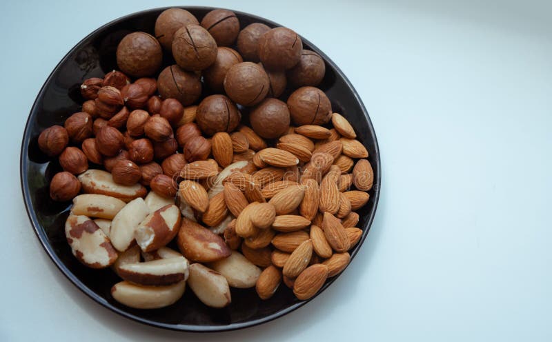 Different Types Useful Nuts Laid Out on a Plate Stock Photo - Image of ...