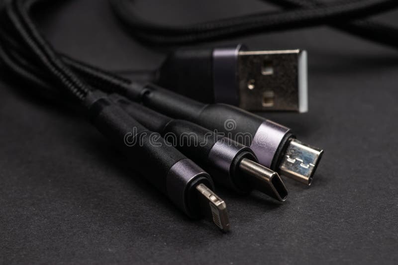 Different USB Charging Plugs on Dark Background. USB Type C, Micro USB ...
