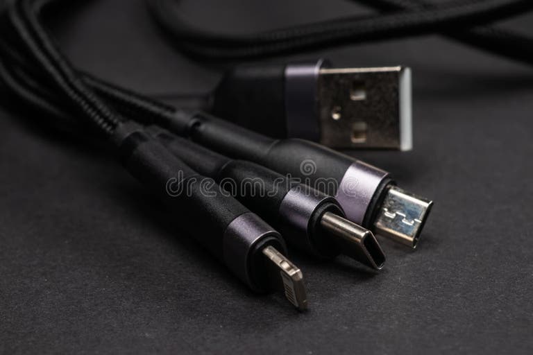 Different USB Charging Plugs on Dark Background. USB Type C, Micro USB ...