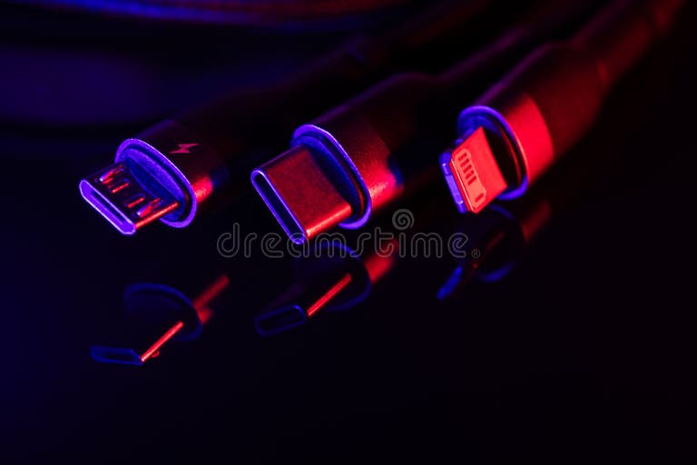 Different USB Charging Plugs on Dark Background. USB Type C, Micro USB ...
