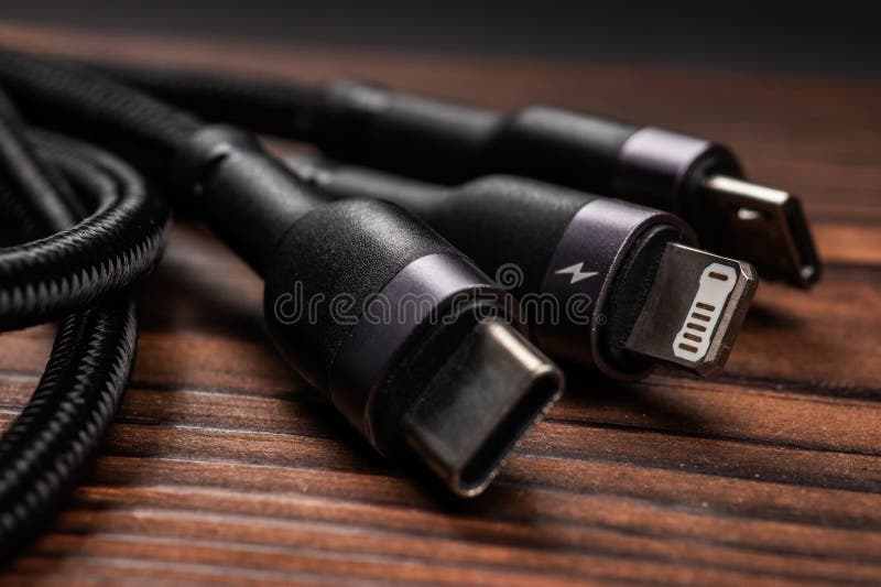 Different USB Charging Plugs on Wooden Background. USB Type C, Micro ...