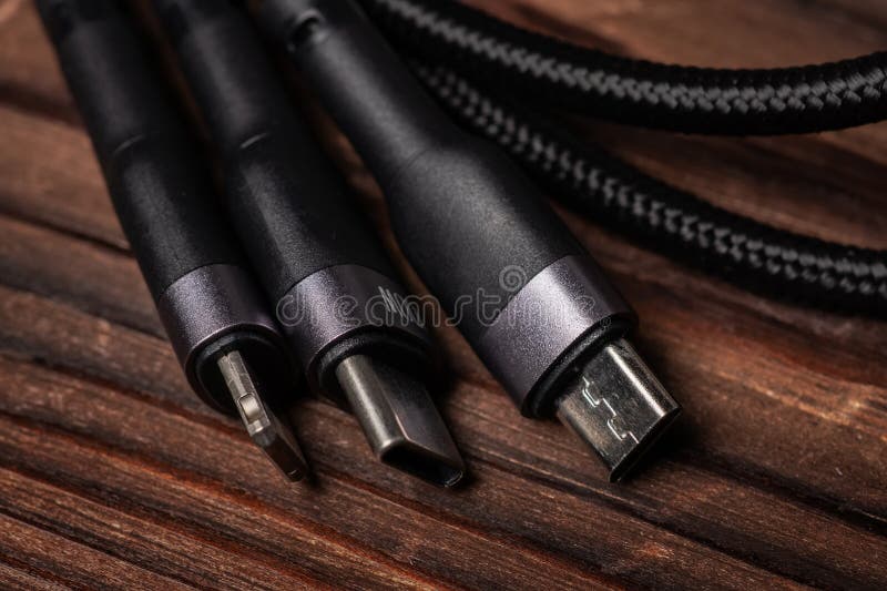 Different USB Charging Plugs on Wooden Background. USB Type C, Micro ...