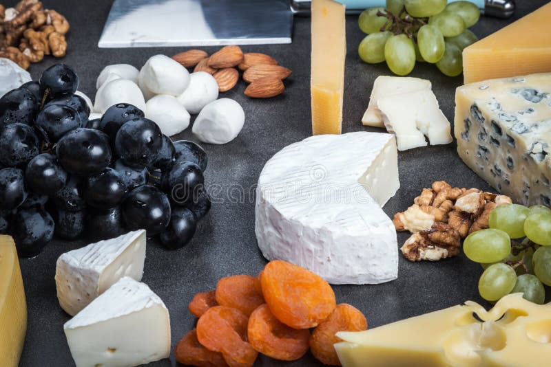 Different Varieties of Cheese with Nuts, Fruits Stock Photo - Image of ...