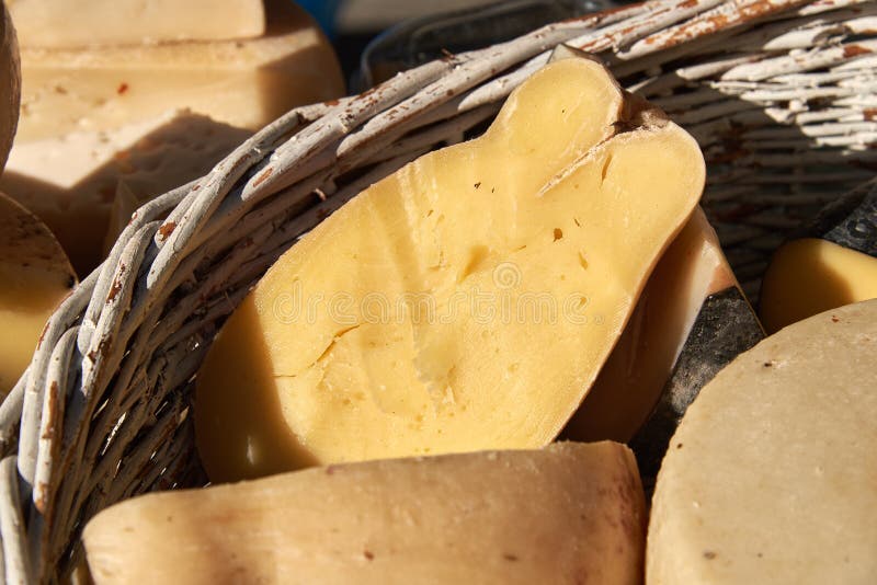 Different Varieties of Cheese in a Wicker Basket Stock Photo - Image of ...