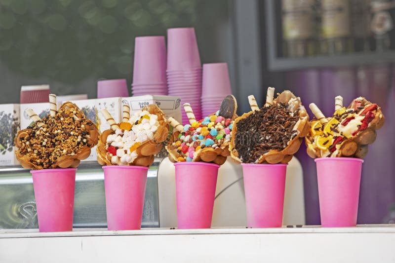 Different Varieties of Ice Cream in Waffle Cones with Marmesh, Nuts ...