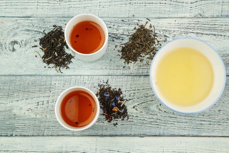 Different Varieties of Tea on the Table and in Tea Glasses on a White ...