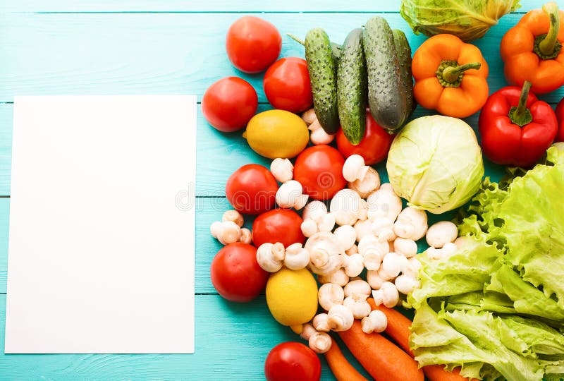 Different Vegetables on Kitchen Table with Recipe List and Copy Space ...