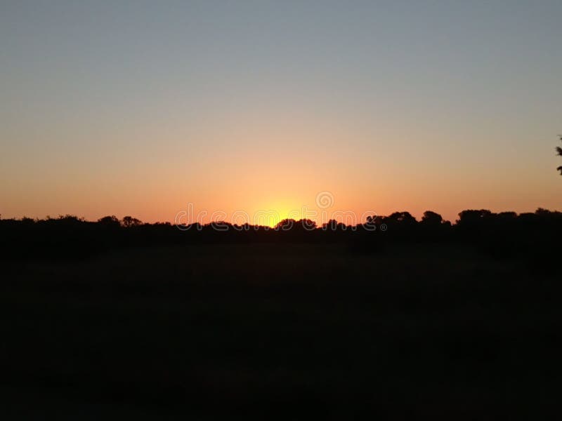 Different Worlds, Same Sunset Stock Image - Image of plain, worlds ...