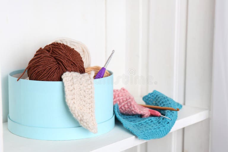 Different Yarns, Pattern Samples and Crochet Hooks on White Shelf Stock ...