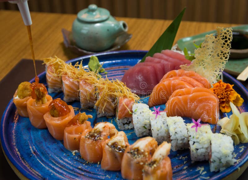 Differents Japanese Sushi on a Elegant Blue Plate Stock Photo - Image ...
