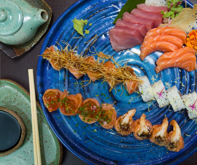 Differents Japanese Sushi on a Elegant Blue Plate Stock Photo - Image ...