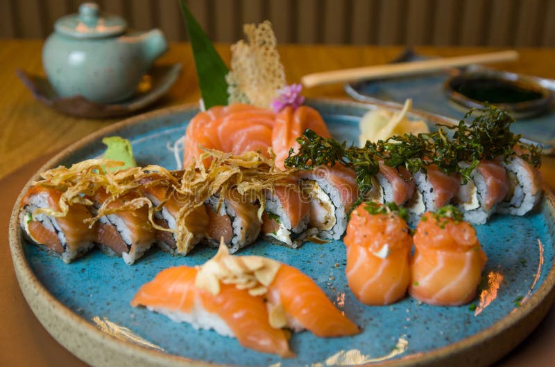 Differents Japanese Sushi on a Elegant Blue Plate Stock Photo - Image ...
