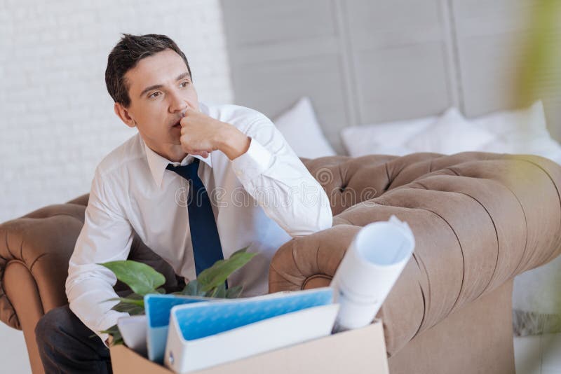Smart Qualified Specialist Thinking while Sitting in an Armchair Stock ...